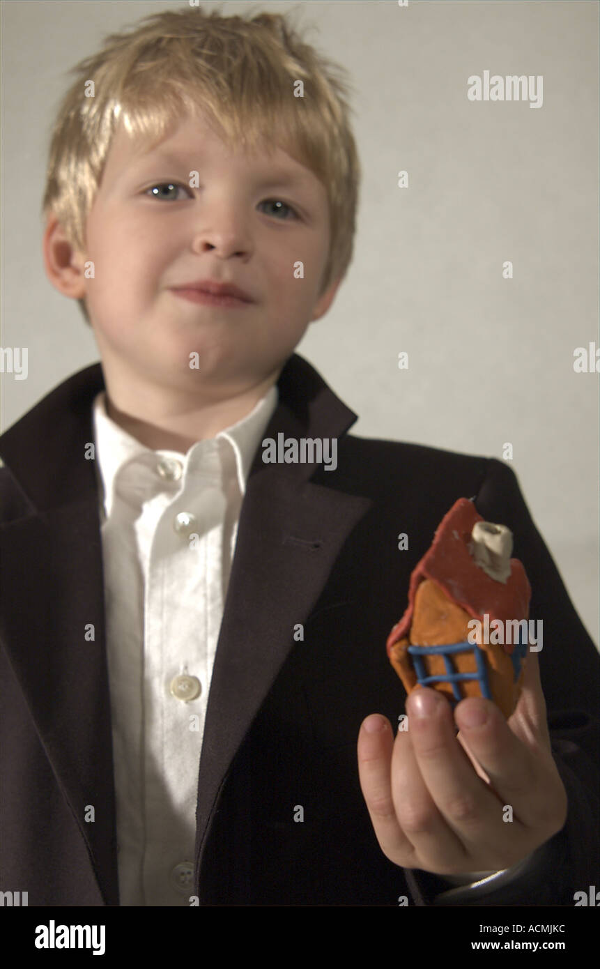 Fair boy with a toy in hand Stock Photo - Alamy