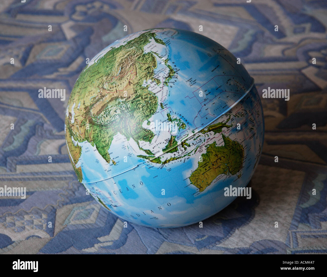 the map of the world ball sphere on the bed Stock Photo - Alamy