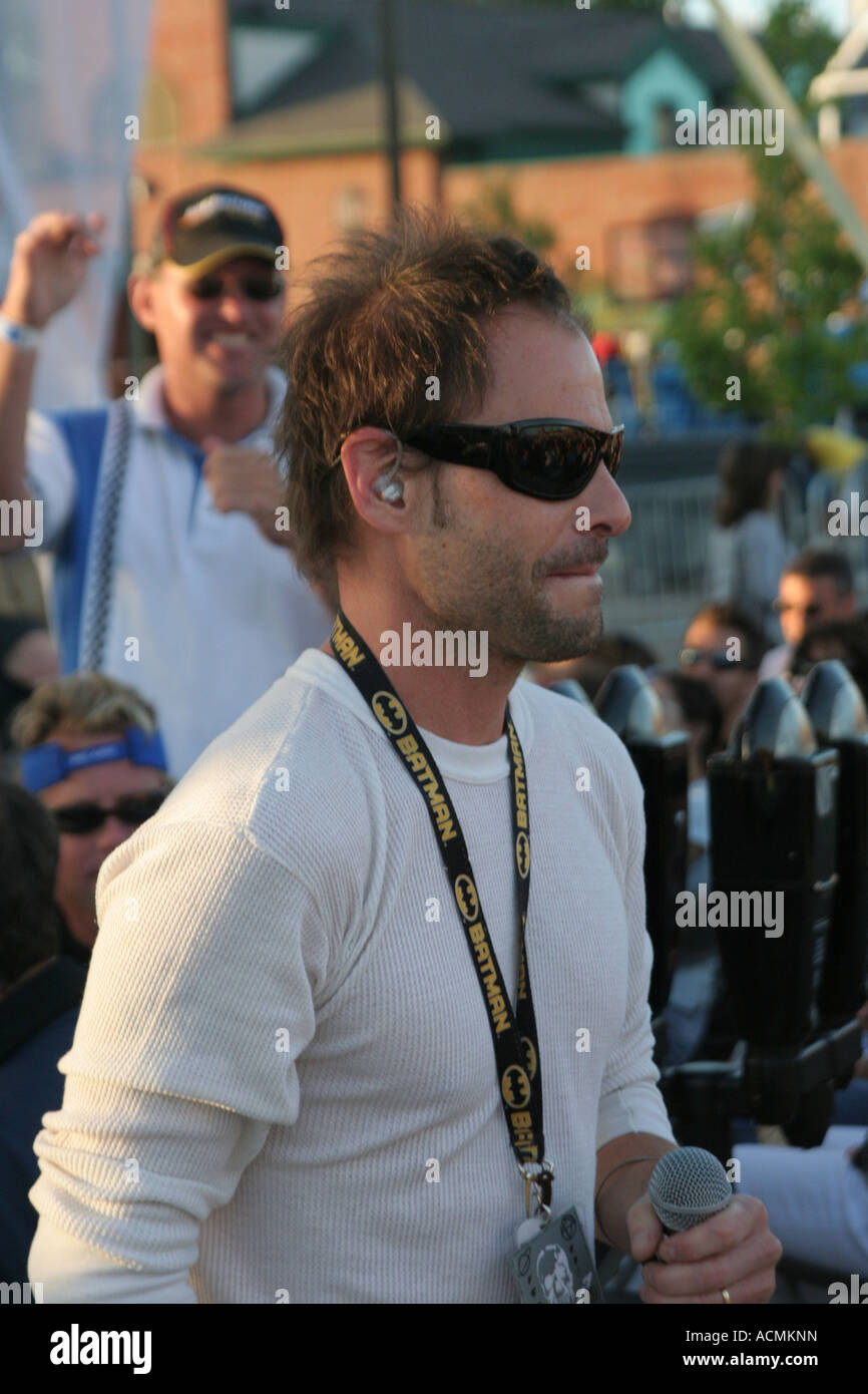 Gin Blossoms lead singer Robin Wilson making his way towards the crowd ...