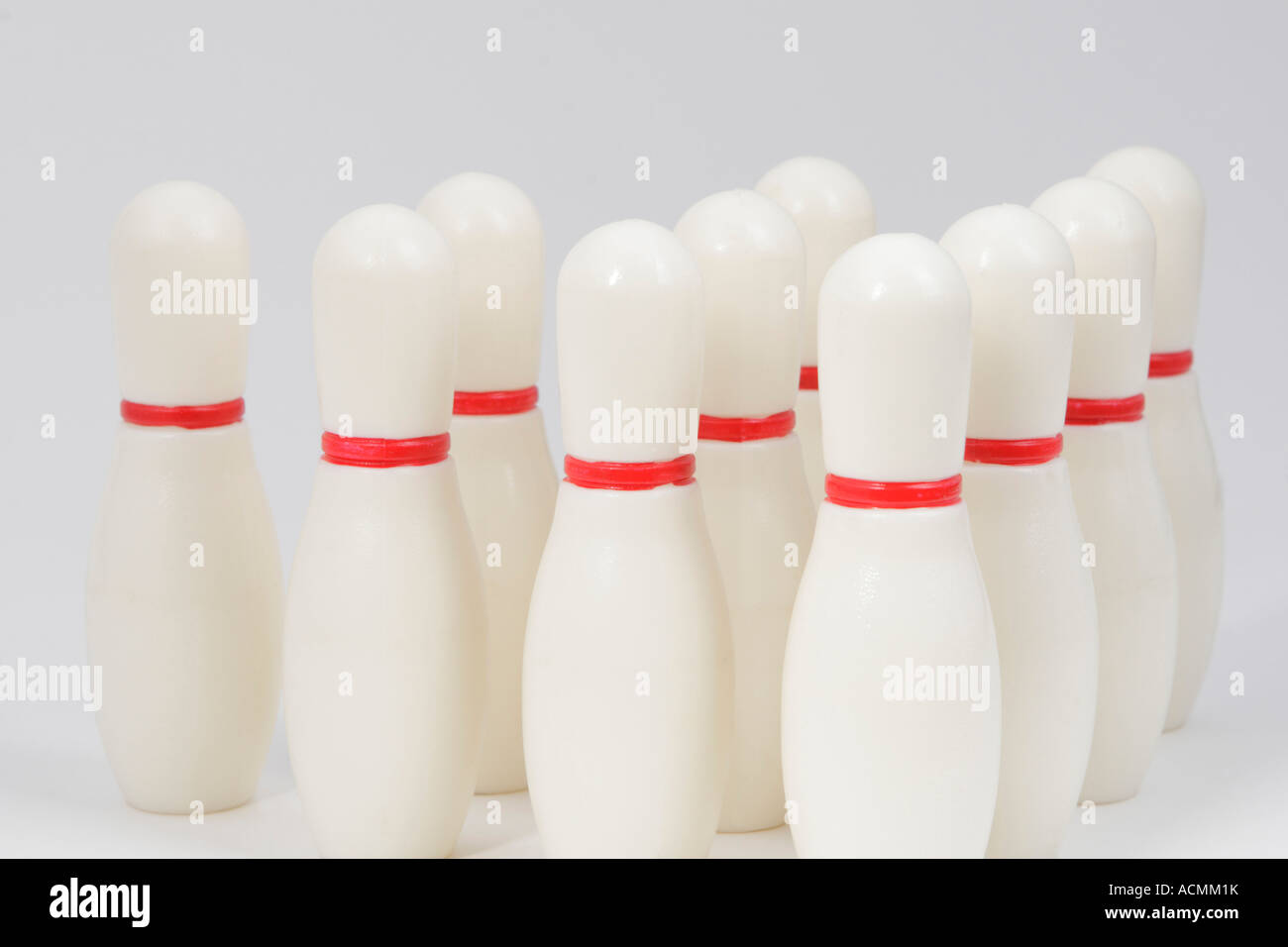 Toy plastic bowling pins on white background Stock Photo - Alamy
