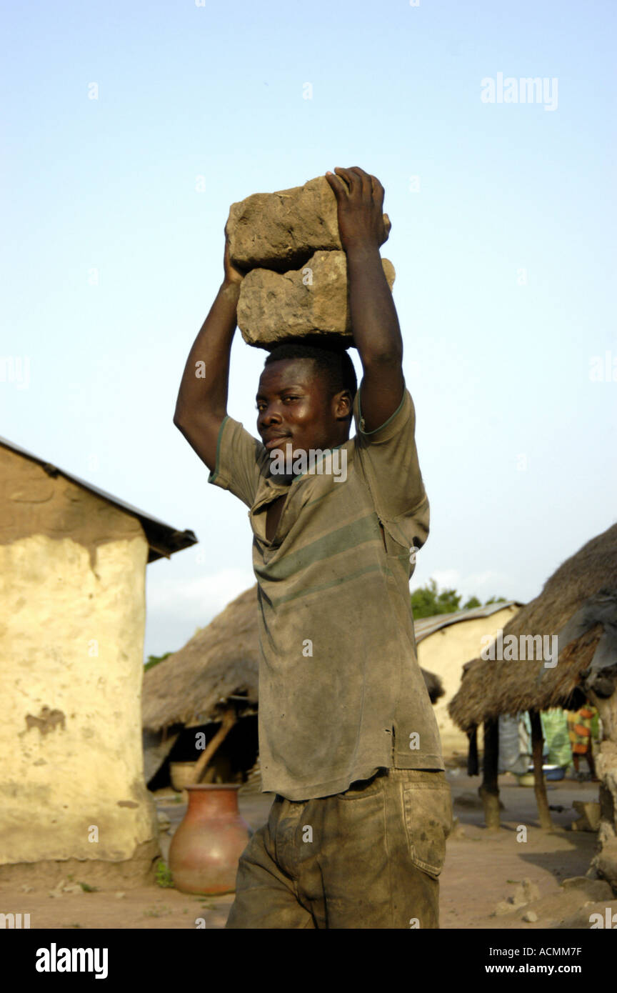 Man carrying cement blocks on his head Togo West Africa Stock Photo - Alamy