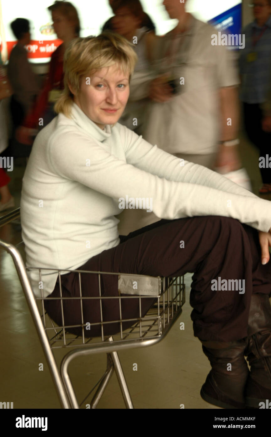 Blonde woman in airport hi-res stock photography and images - Alamy