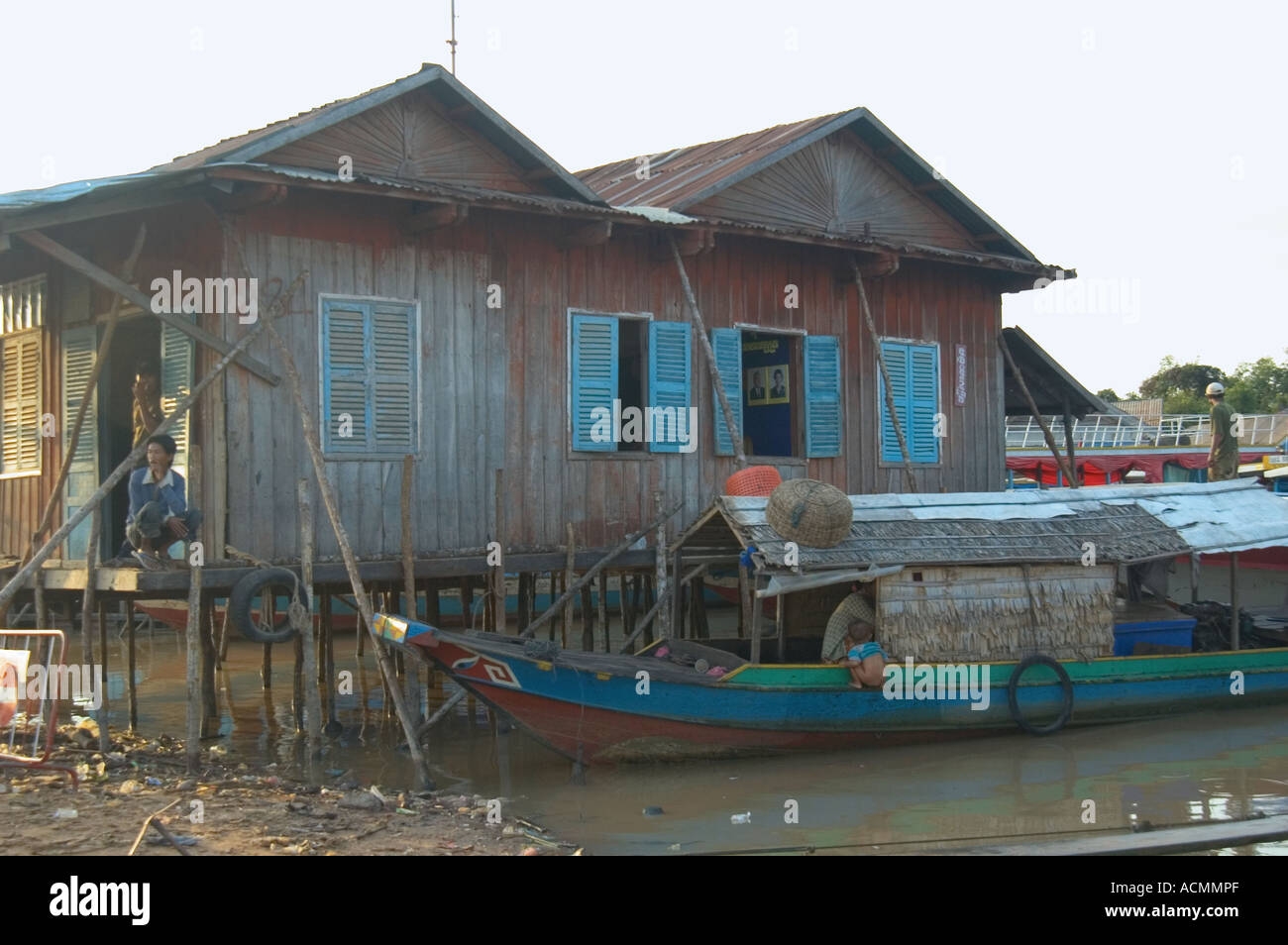 Brush house and moored boat Stock Photo - Alamy