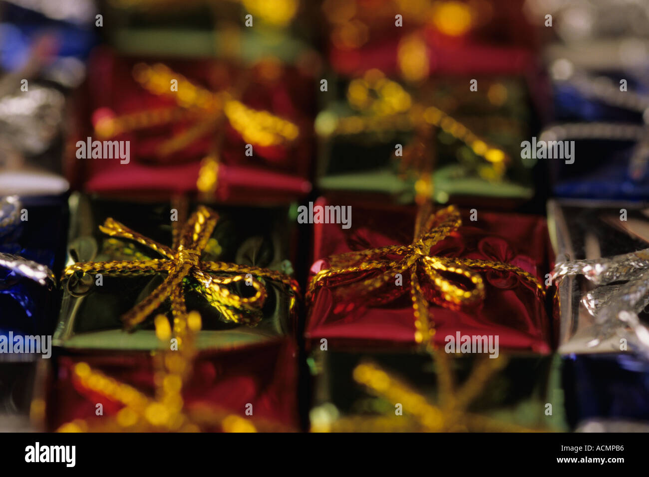 Christmas gift boxes small lined up in rows multi colored with ribbon ...