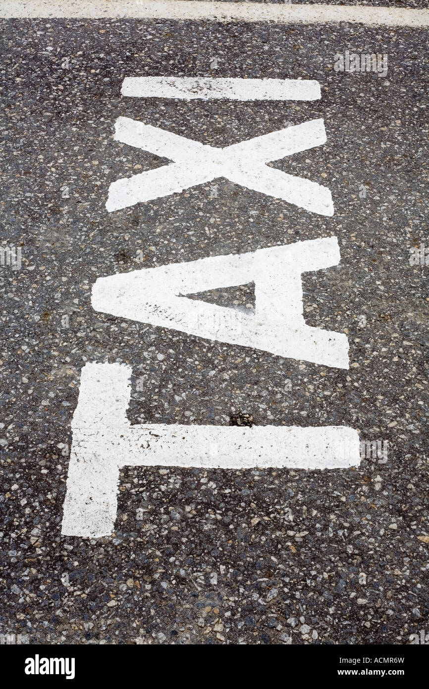 Taxi word painted on tarmac Stock Photo - Alamy