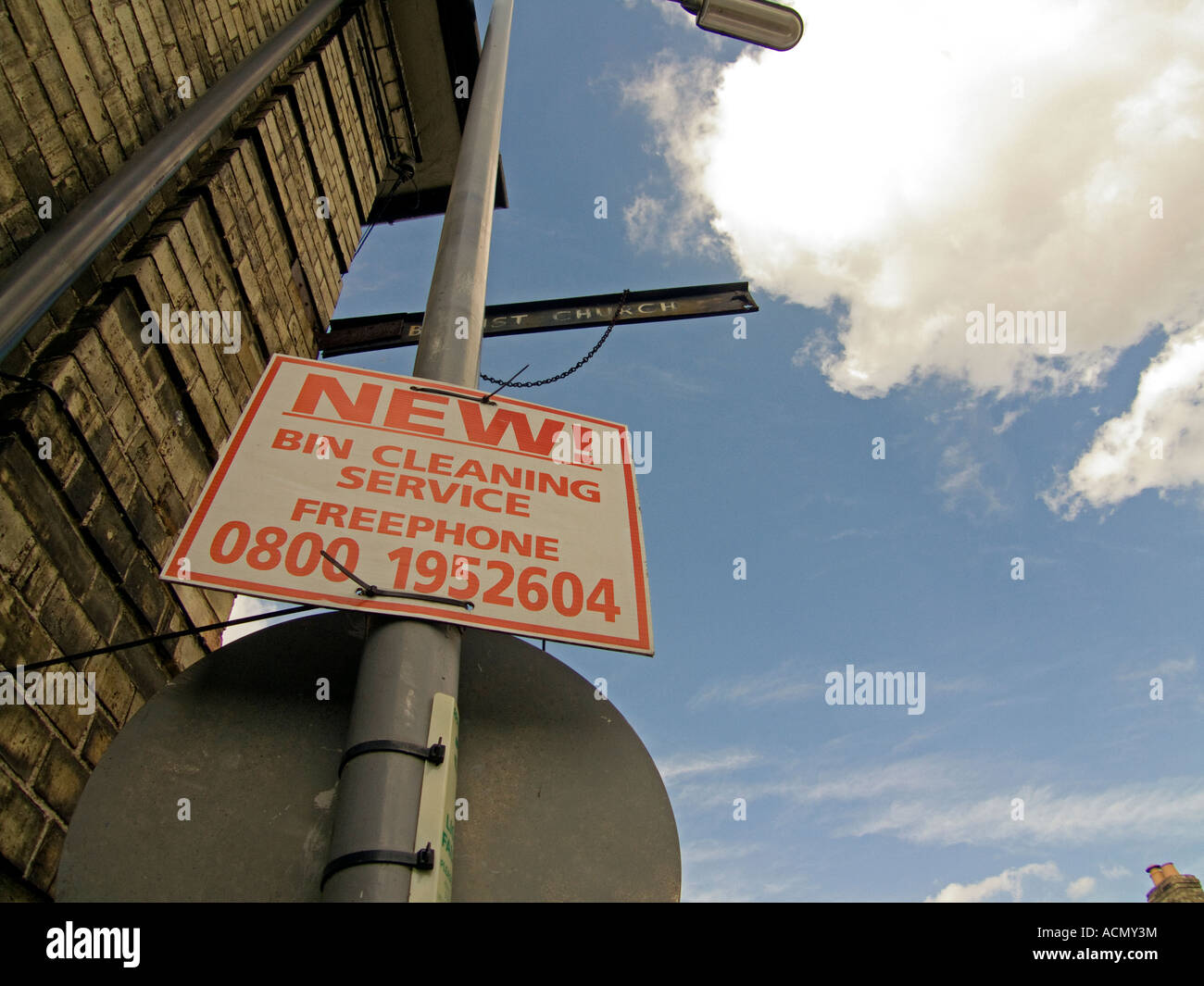 Bin cleaning service sign post Stock Photo - Alamy