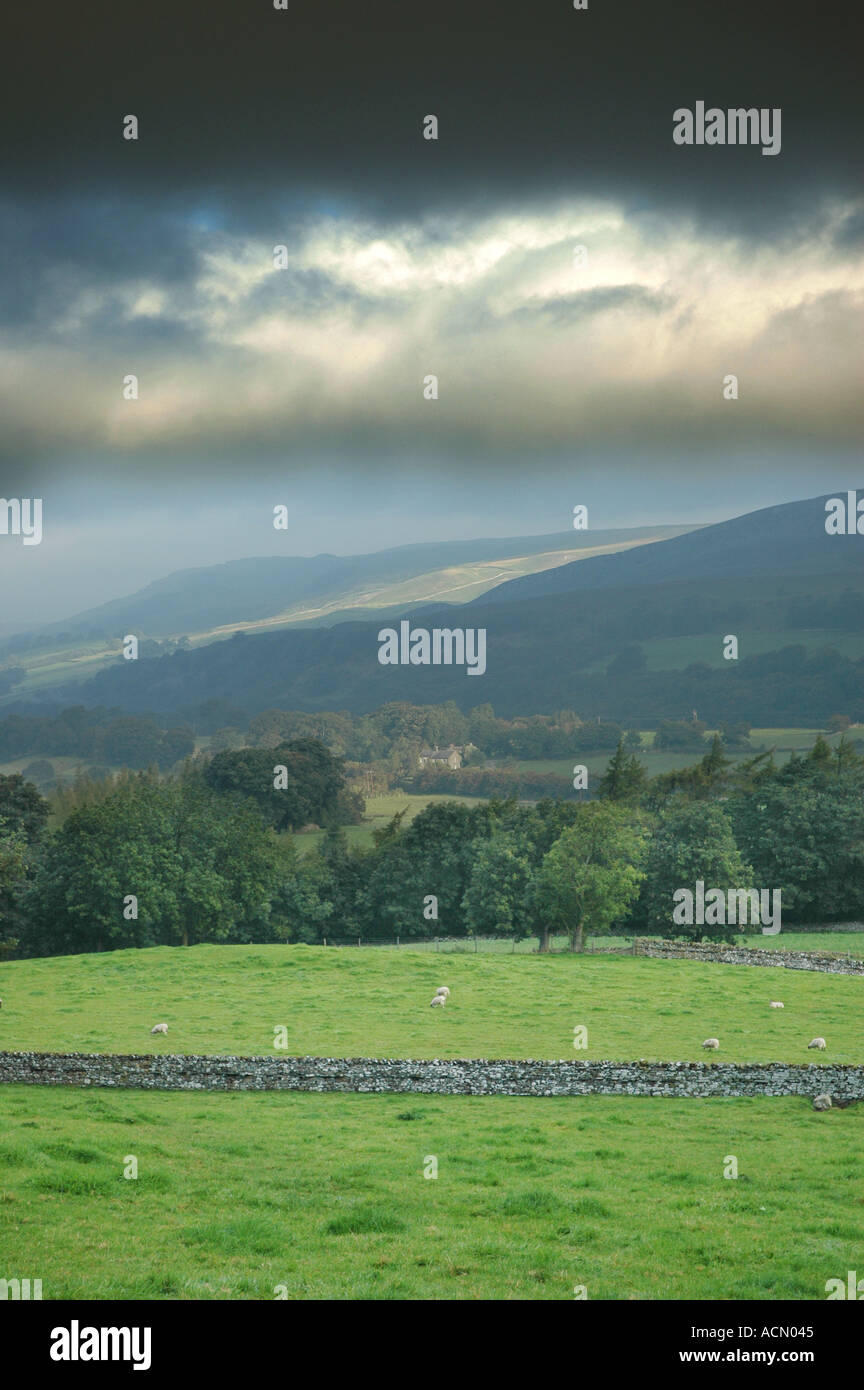 Moody sky over stone house and fields Yorkshire England Stock Photo - Alamy