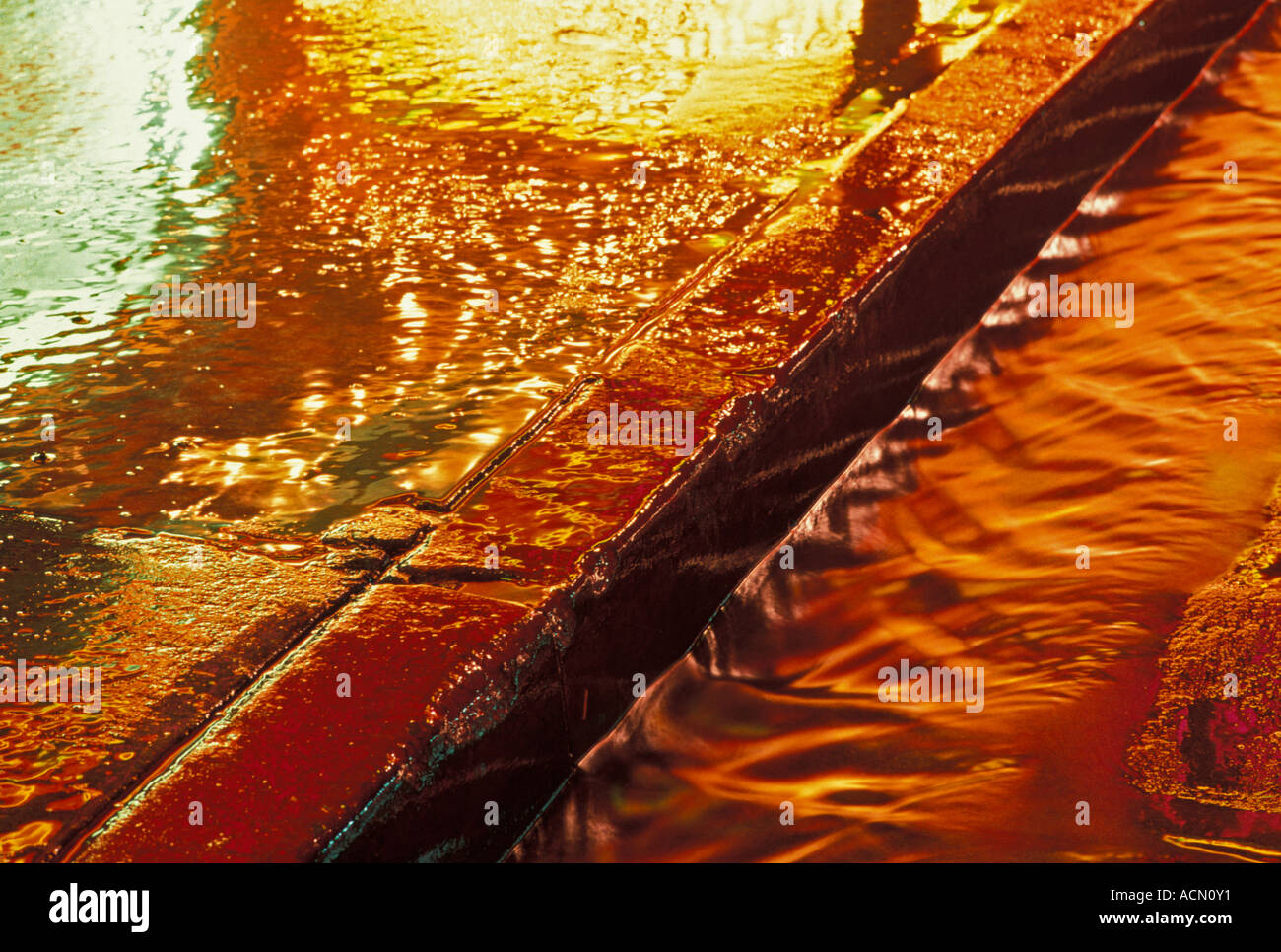 Rain flowing down a curb in Los Angeles California United States of ...