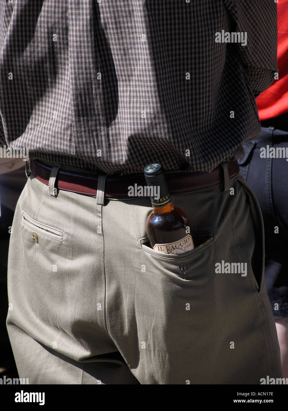 Man carrying wine bottle hi-res stock photography and images - Alamy
