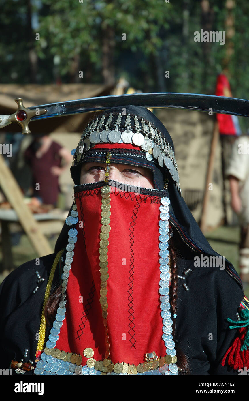 Veiled arab woman traditional sword hi-res stock photography and images ...
