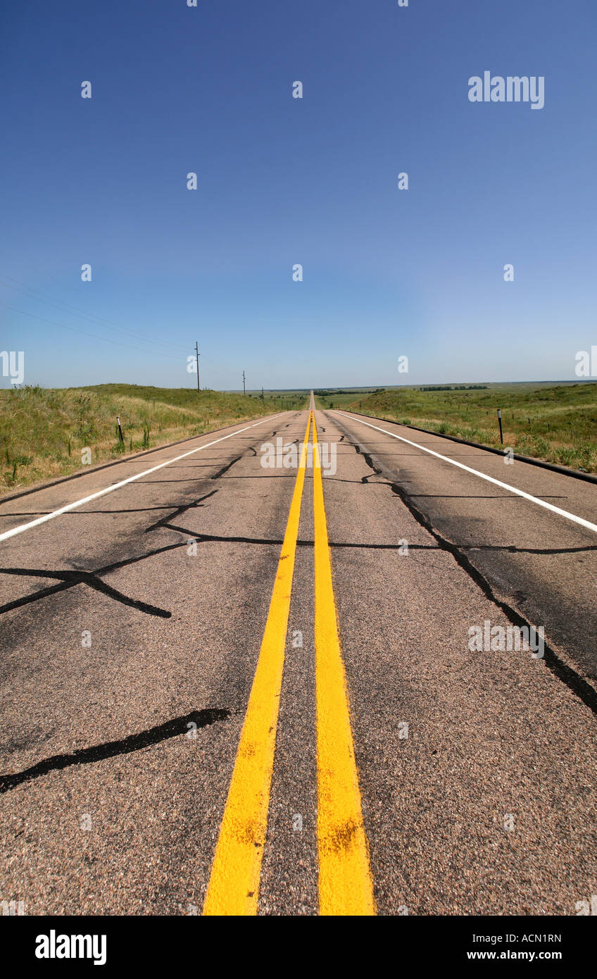 Looking down a lonely deserted highway that goes on forever in Nebraska ...