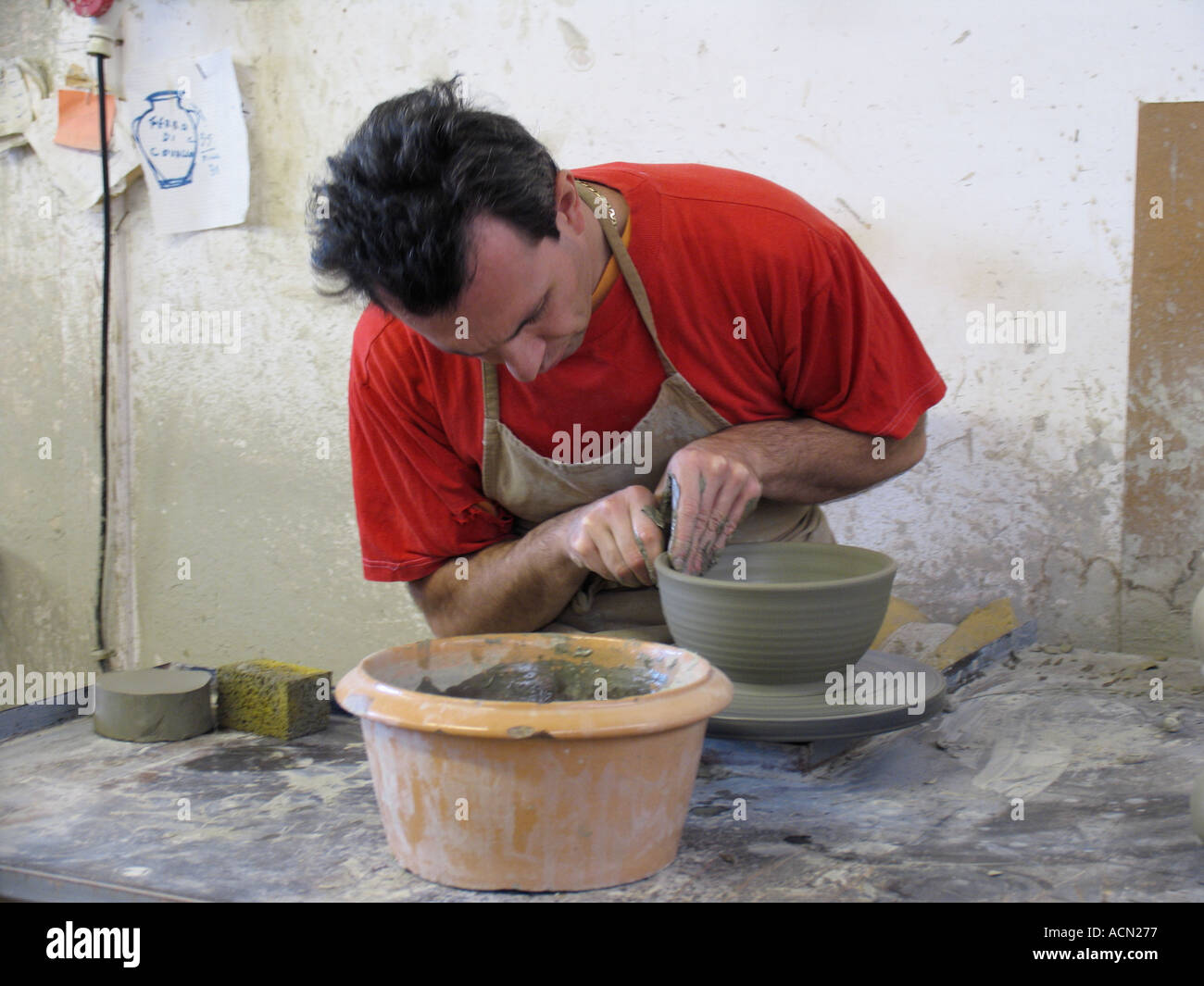 Hands shaping clay on a wheel hi-res stock photography and images - Alamy
