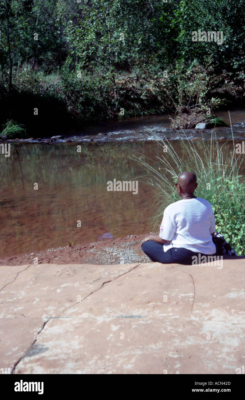 African woman meditating sitting hi-res stock photography and images ...