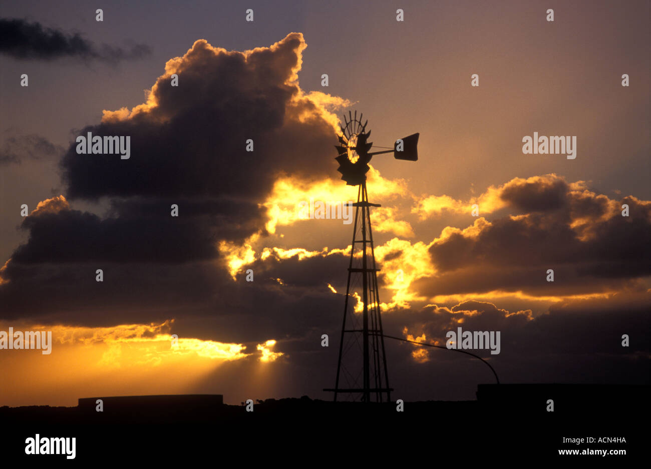 A photo of a windmill and sun lit clouds. photo by Bruce Miller Stock ...