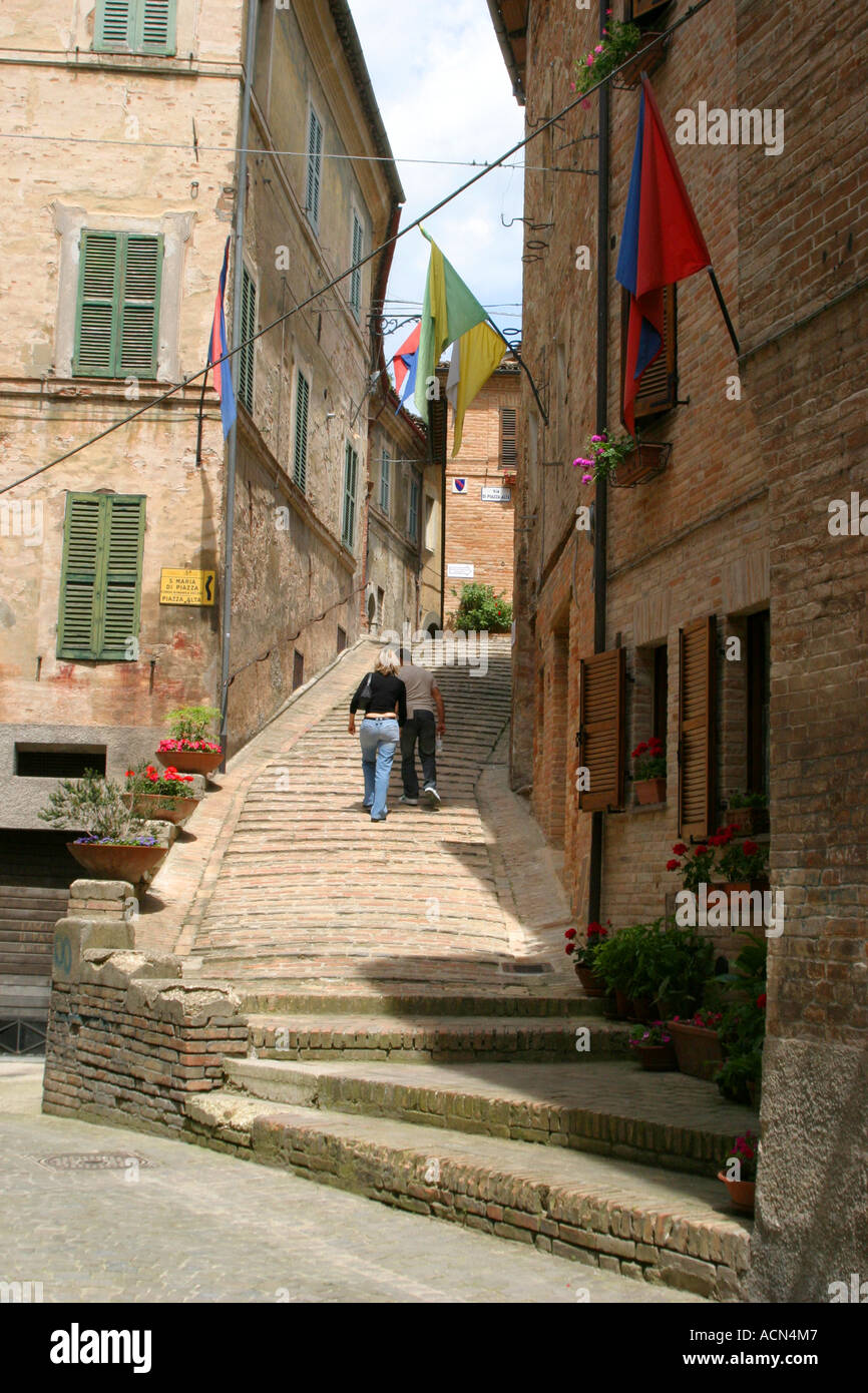 visitors strolling the ancient passageways of Sarnano in Le Marche ...