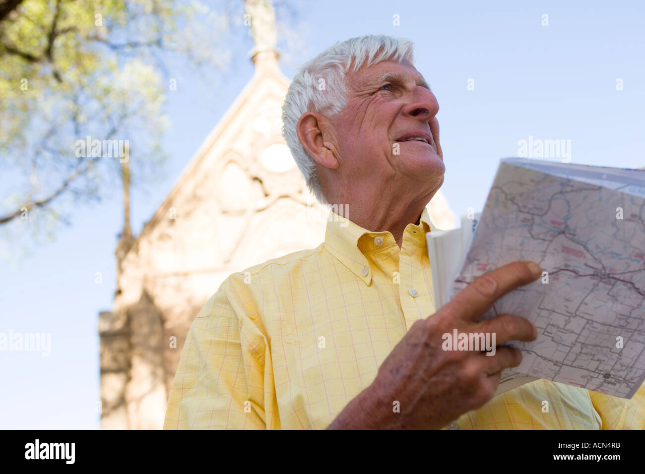 senior man reading map while on vacation Stock Photo - Alamy