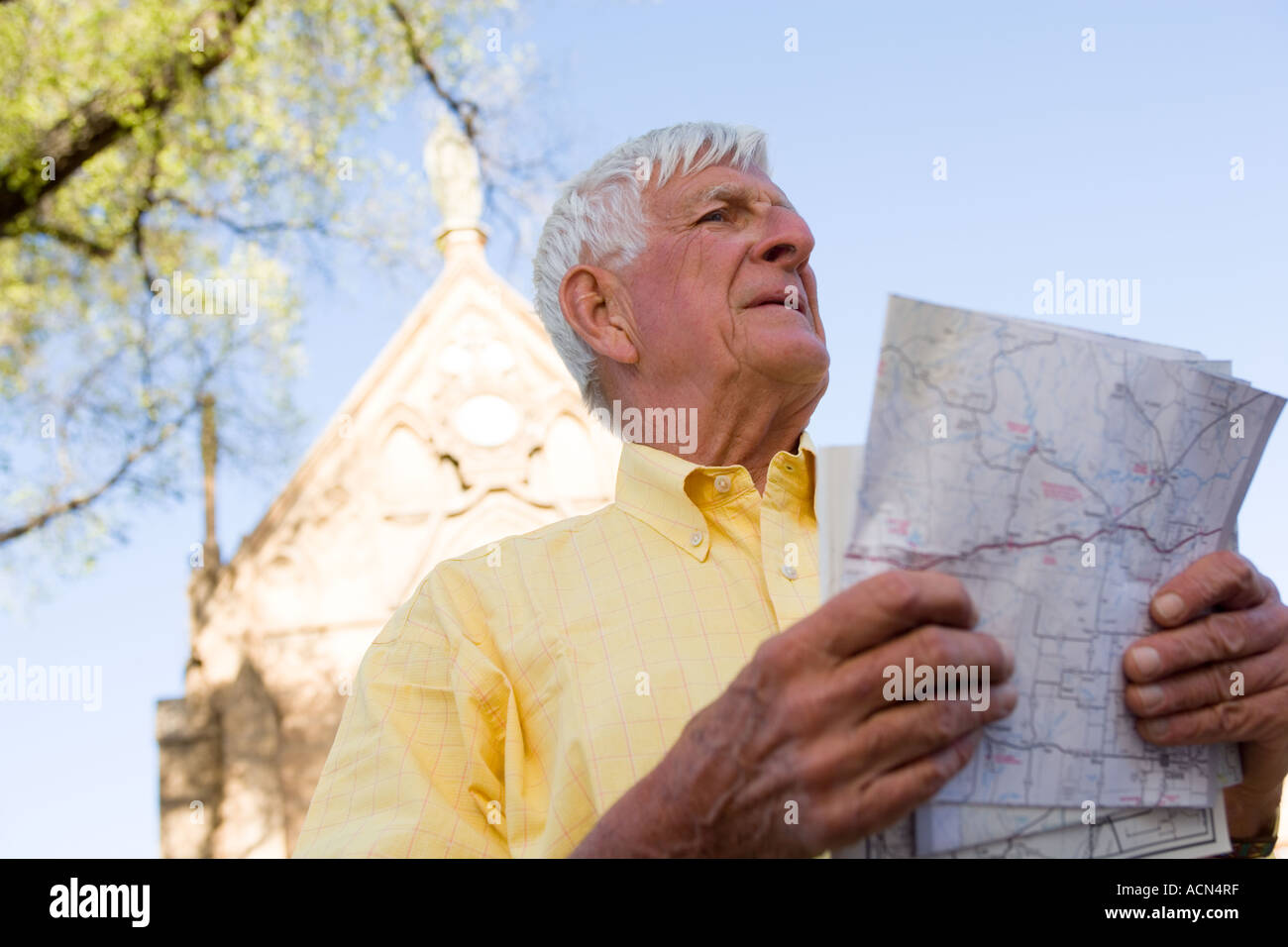 senior man reading map while on vacation Stock Photo - Alamy