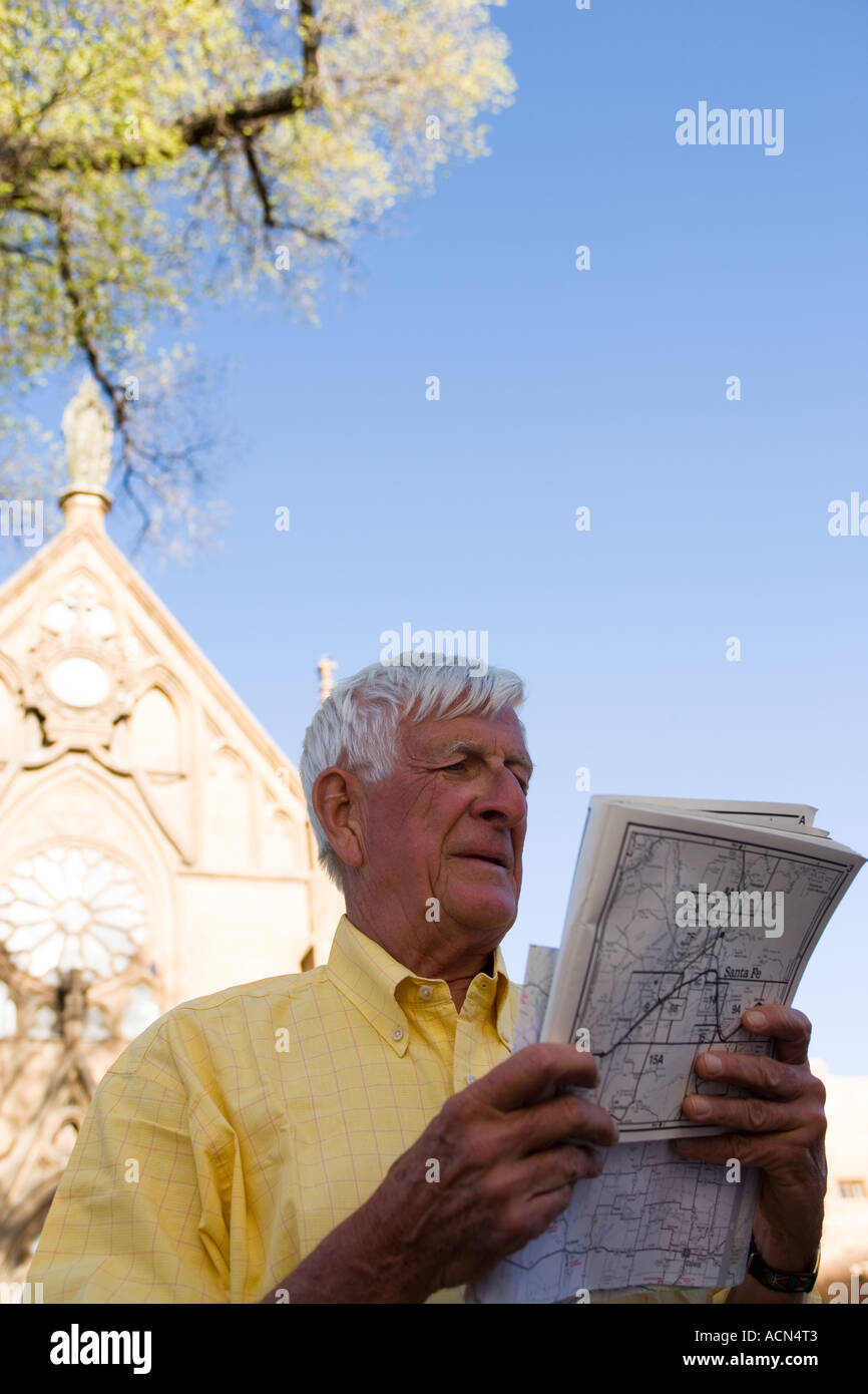 senior man reading map while on vacation Stock Photo - Alamy