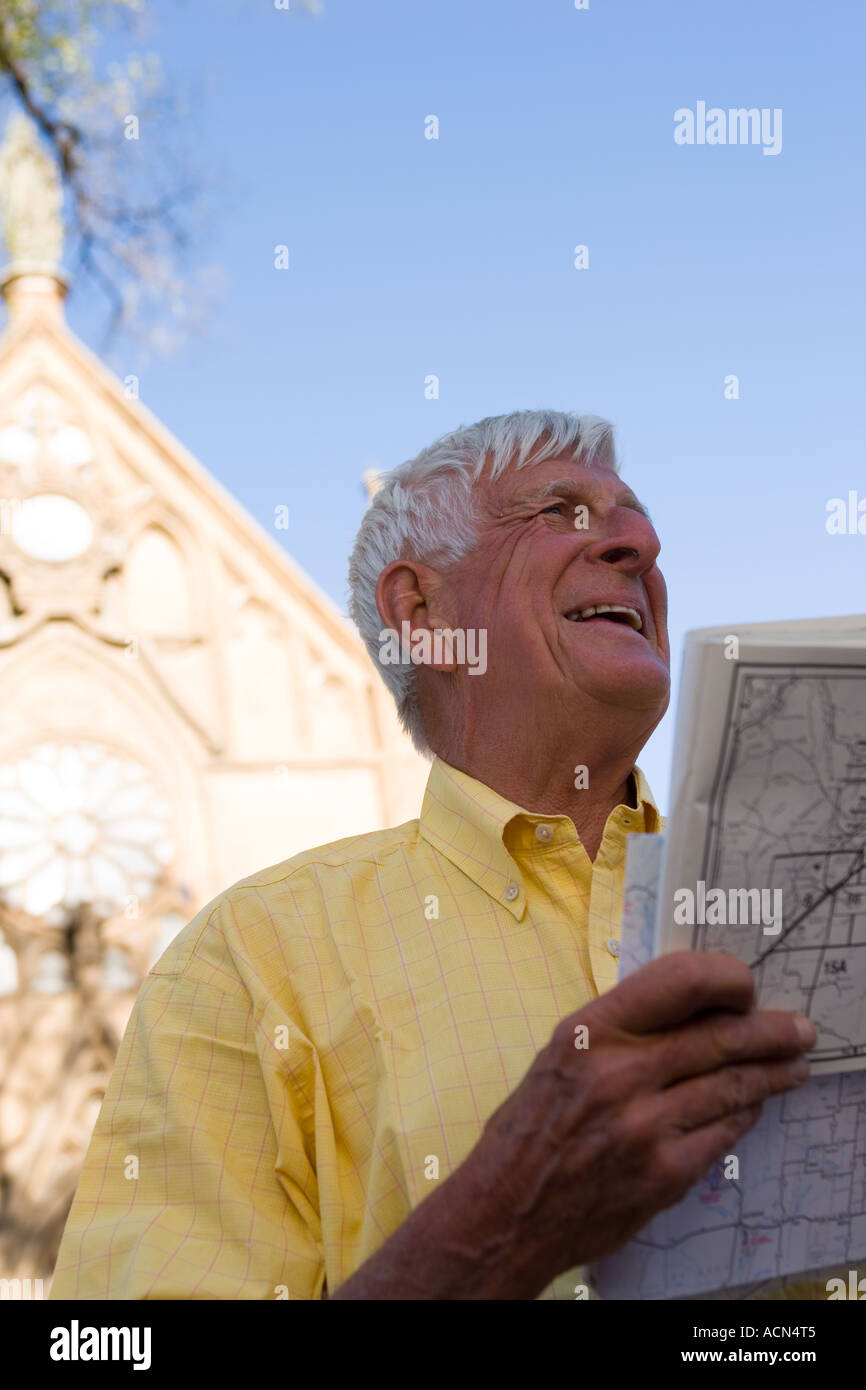 senior man reading map while on vacation Stock Photo - Alamy