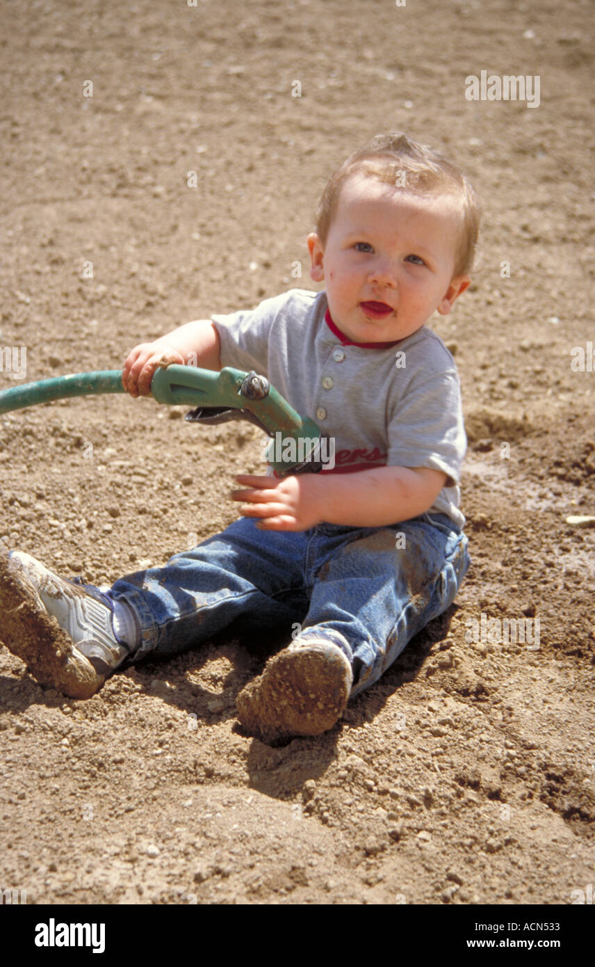 Toddler playing mud hi-res stock photography and images - Alamy