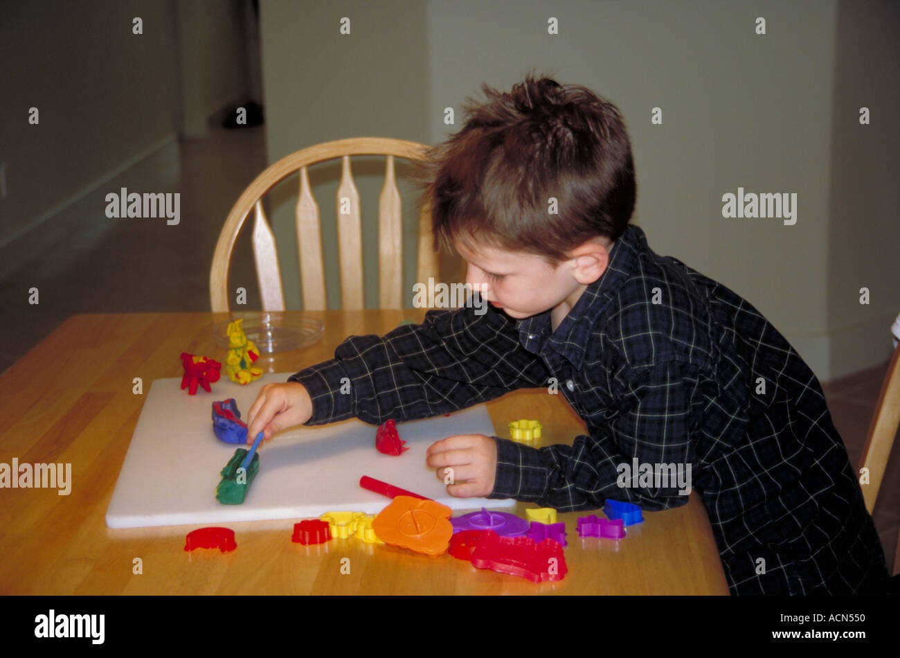 Child Playing with Clay Stock Photo - Alamy