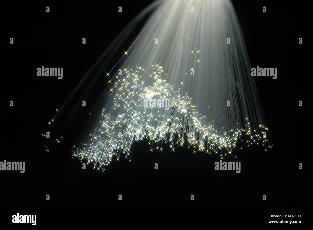 Stream of light flows from fiber optic cable dsc 6011 Stock Photo - Alamy