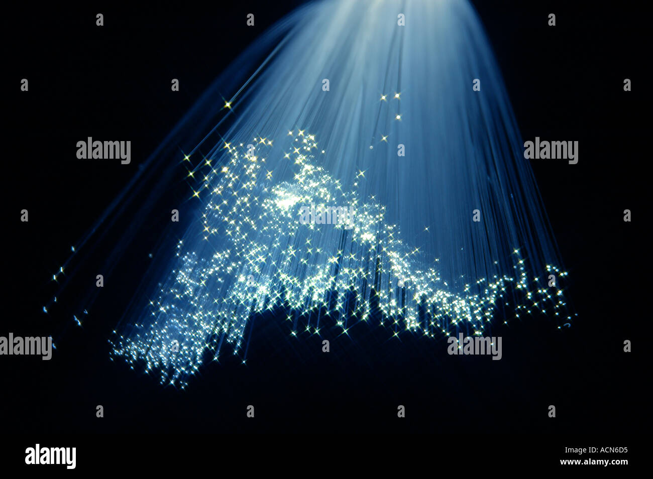 Stream of light flows from fiber optic cable dsc 6012 Stock Photo - Alamy