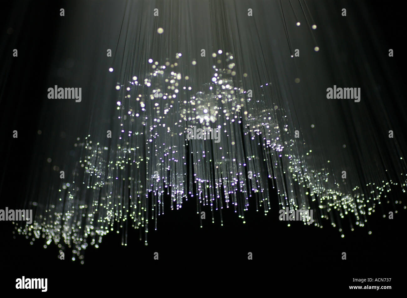 Stream of light flows from fiber optic cable dsc 6021 Stock Photo - Alamy