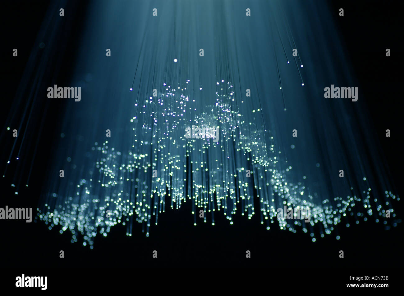 Stream of light flows from fiber optic cable dsc 6023 Stock Photo - Alamy