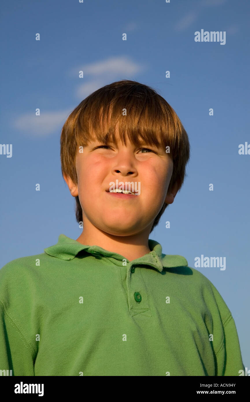 Young boy watching the sunset Stock Photo - Alamy