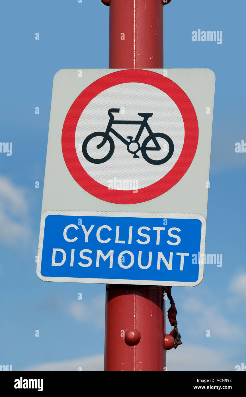 Cyclists dismount reflective sign Newport Gwent South Wales UK Stock ...