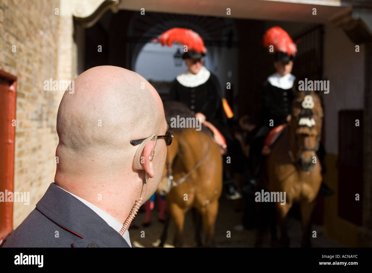 Bald security guard looking at alguacilillos at beginning of initial ...
