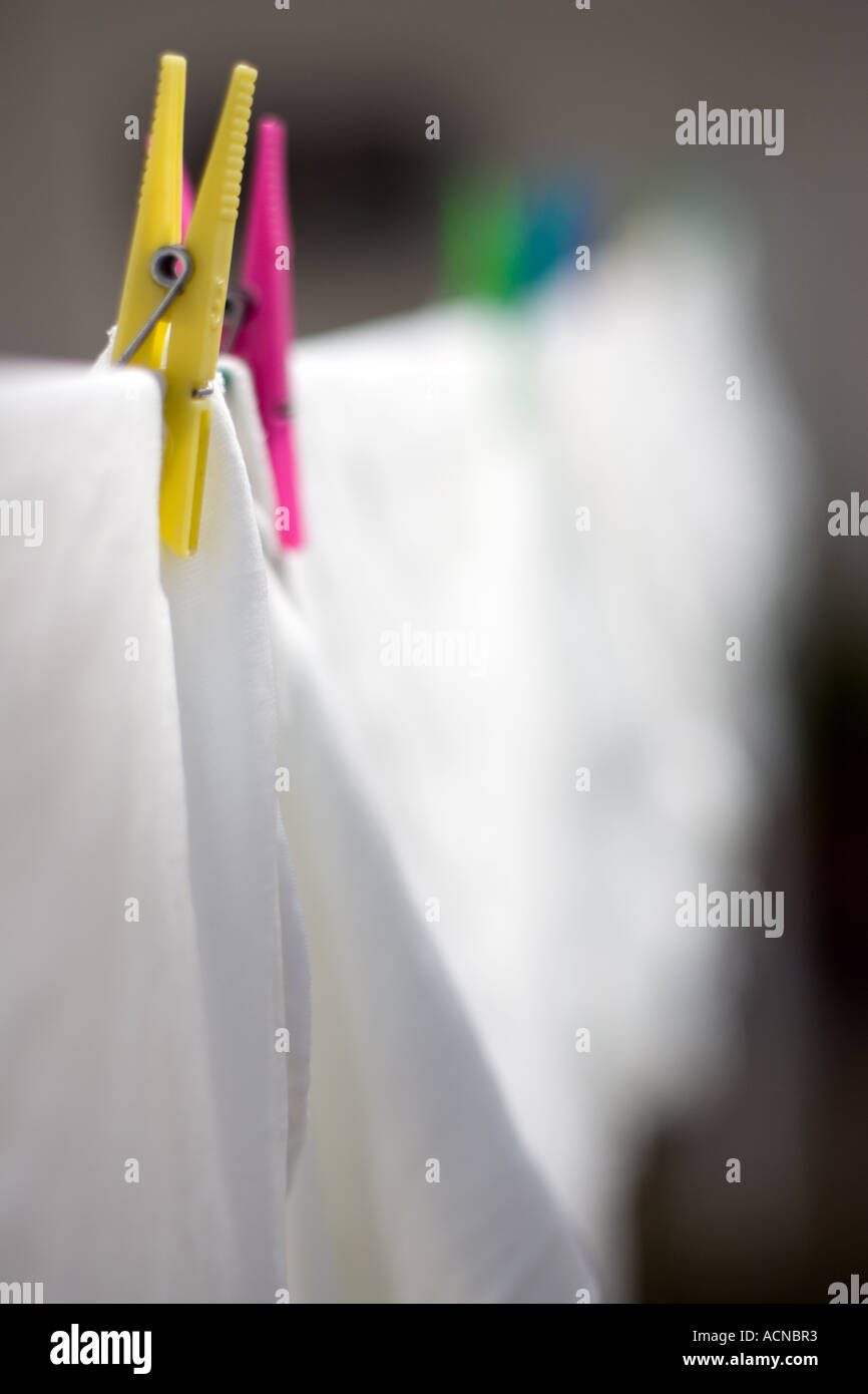 Plastic pegs on a clothes line Stock Photo - Alamy