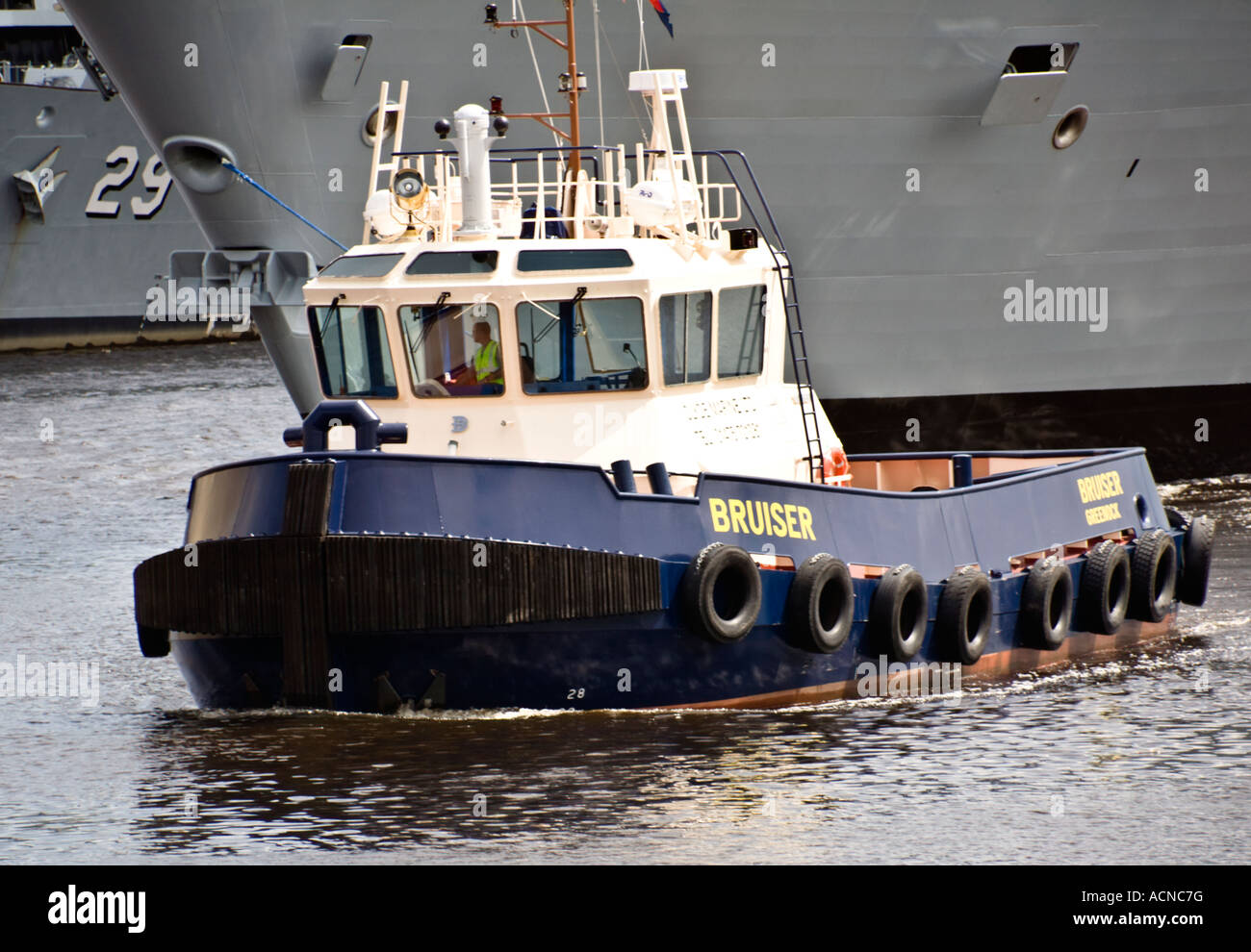 Tug boat and war ship hi-res stock photography and images - Alamy