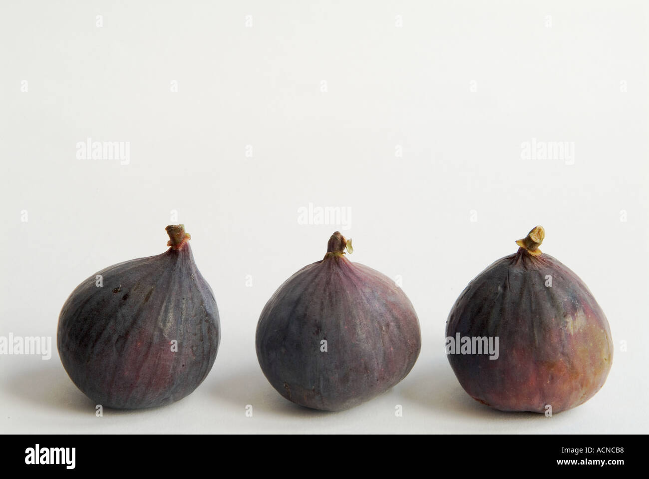 three figs still life Stock Photo - Alamy