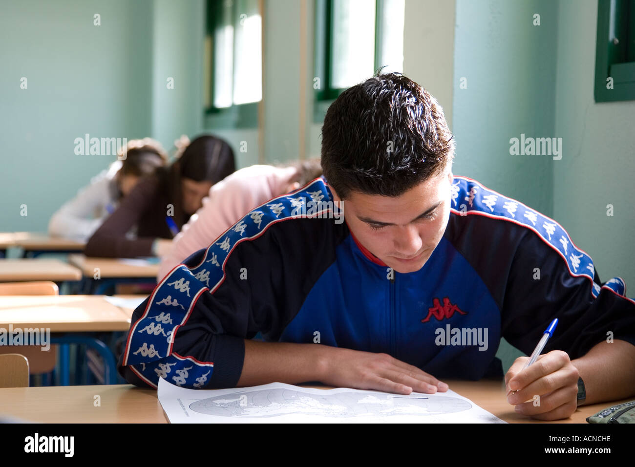 Educational image of students writing a test in class room Stock Photo ...