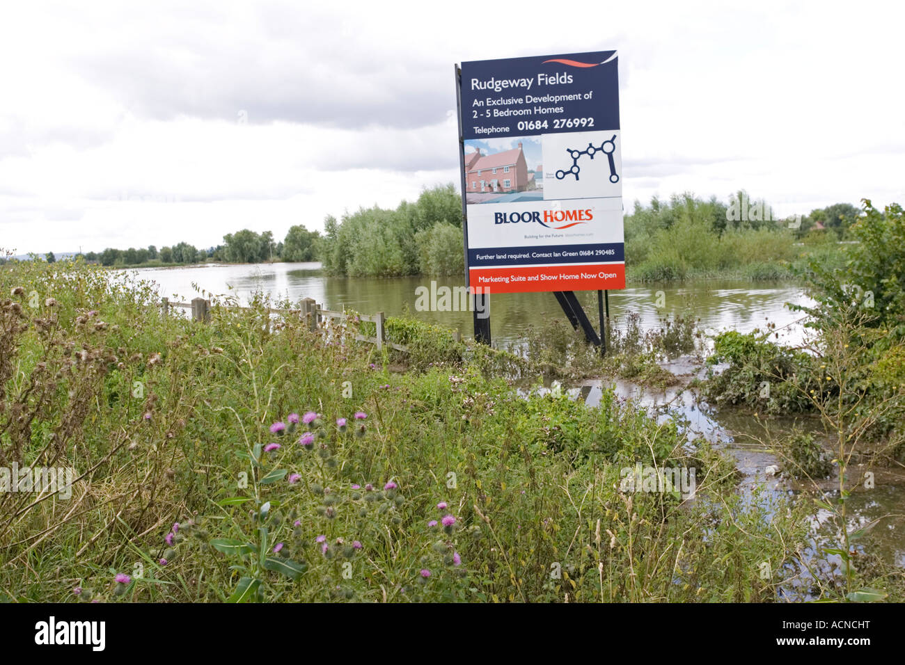 Billboard advertising house building on flood plain hi-res stock ...