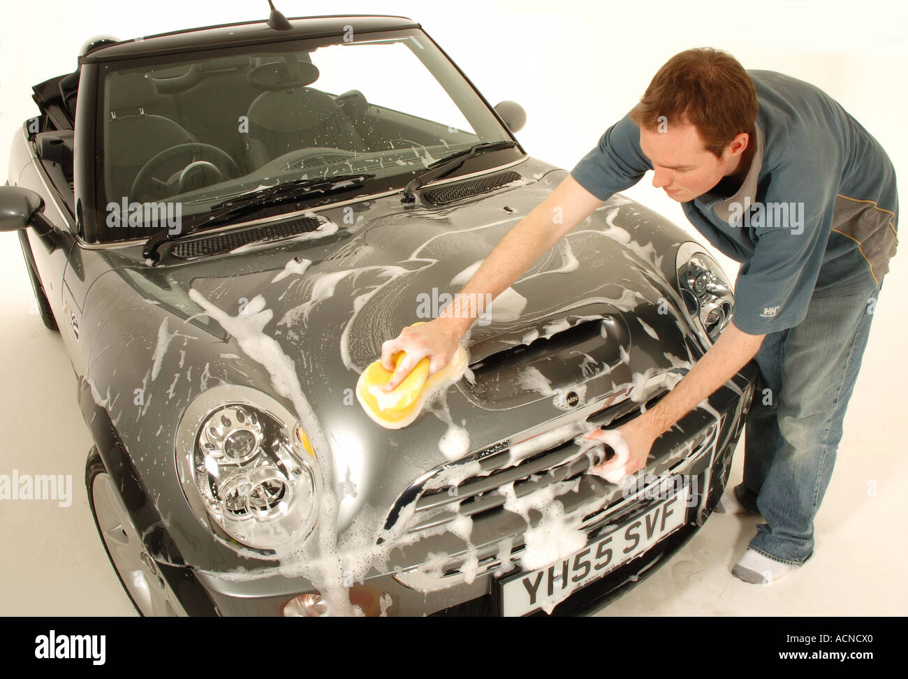 Man cleaning a car Stock Photo - Alamy