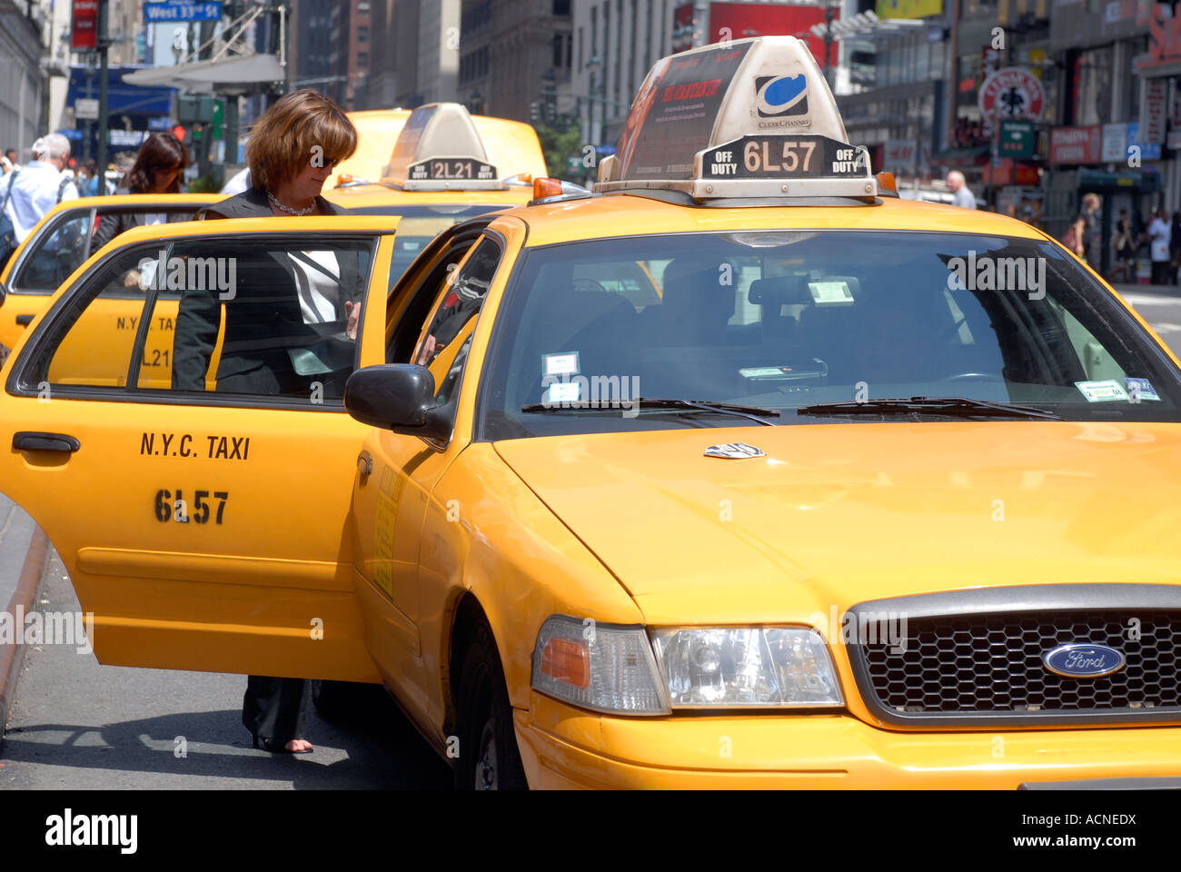 Taxi riders enter cabs at the hack line outside Pennsylvania Station in ...