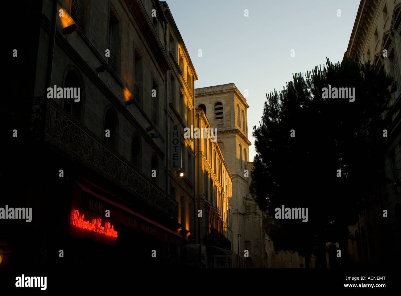 Avignon France evening light in the city with neon restaurant sign Lou ...