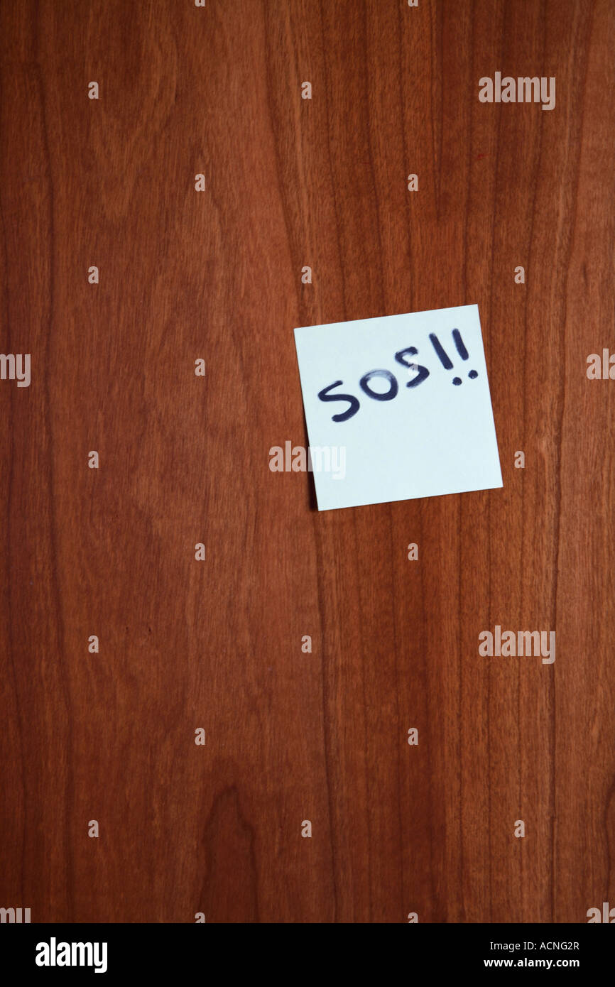 sos ! written on post it note memo Stock Photo - Alamy
