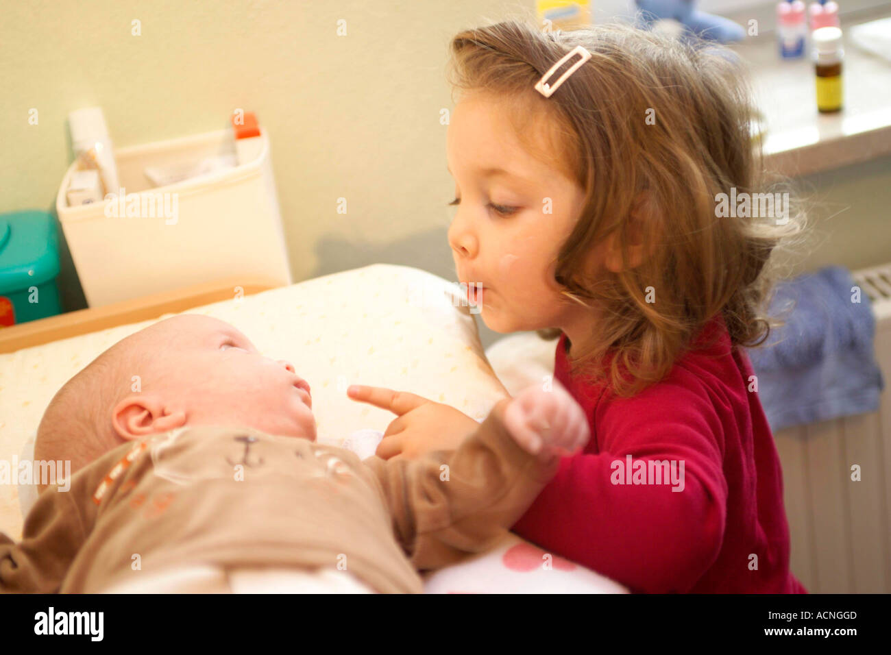 Little girl with baby Stock Photo - Alamy