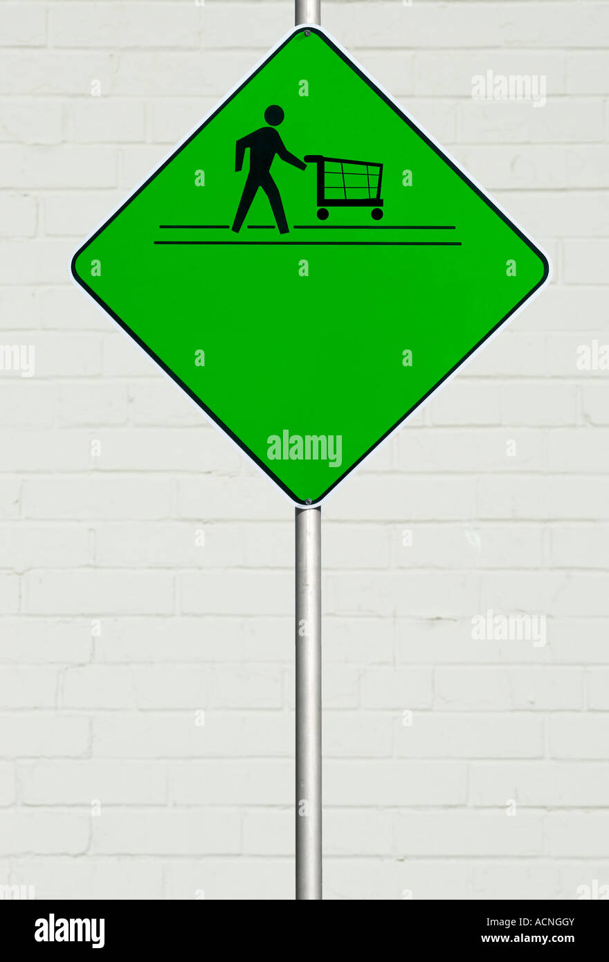 Sign with graphic of shopper pushing cart Stock Photo - Alamy