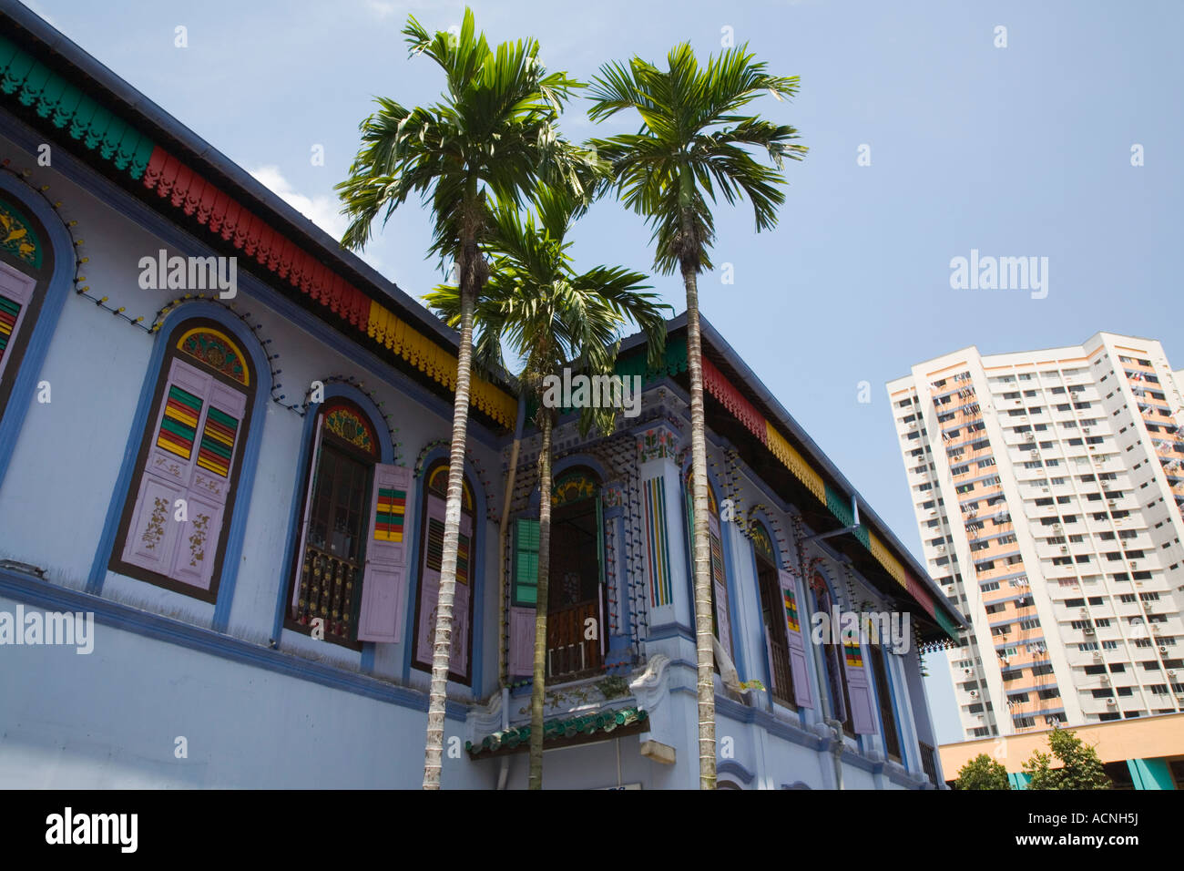 Traditional blue painted old building with ornate window shutters in ...