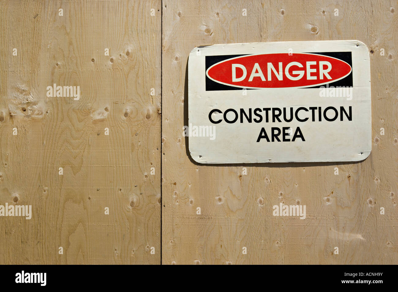 Danger Construction Area sign on plywood wall Stock Photo - Alamy