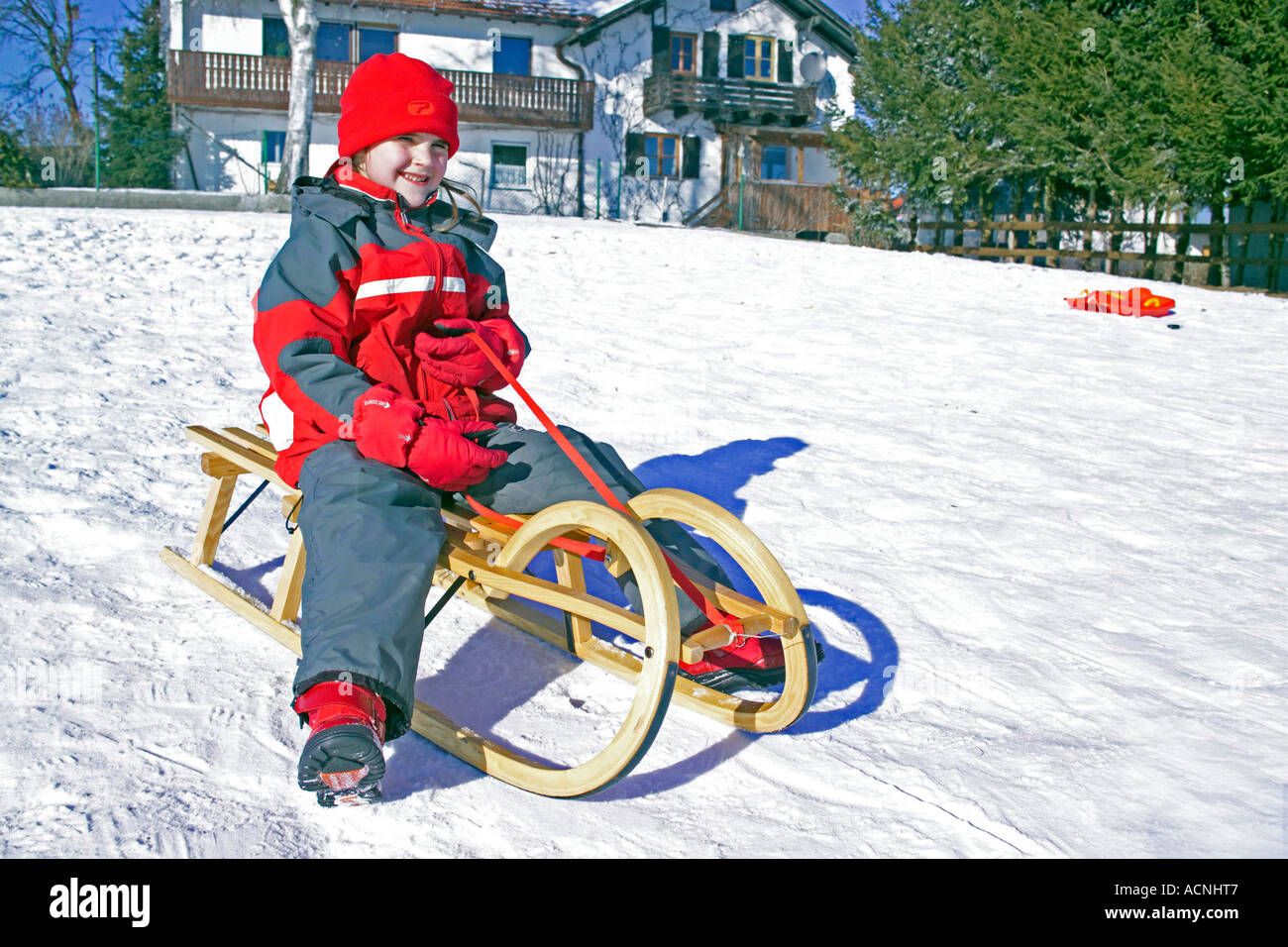 Child with sledge Stock Photo - Alamy