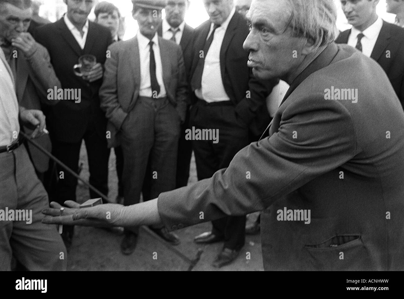 Spinning tossing flipping pennies off a matchbox Gypsies at the Derby ...