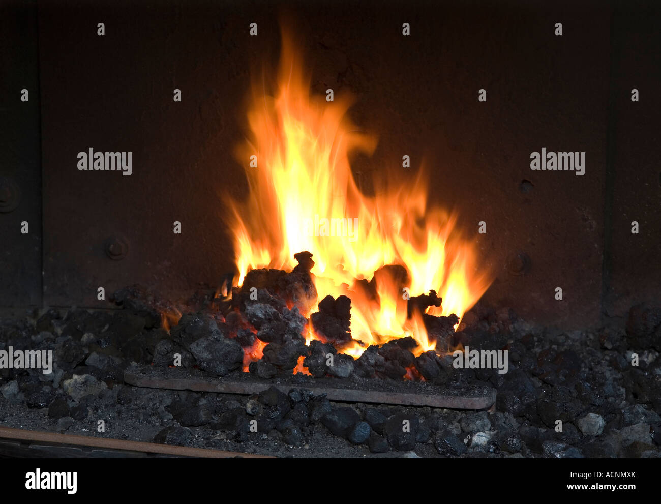Fire in blacksmith's forge Stock Photo - Alamy