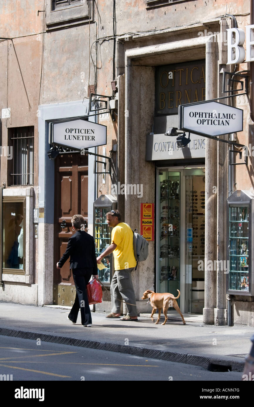 Woman walking dog along Via del Corso Rome Italy Stock Photo - Alamy