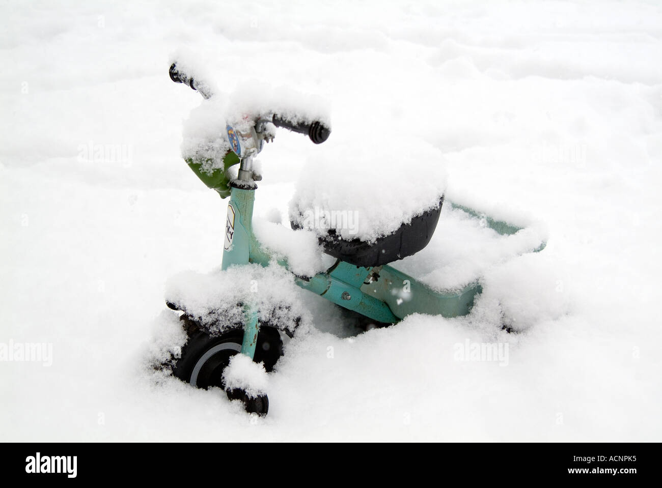 kids tricycle in the snow Stock Photo - Alamy